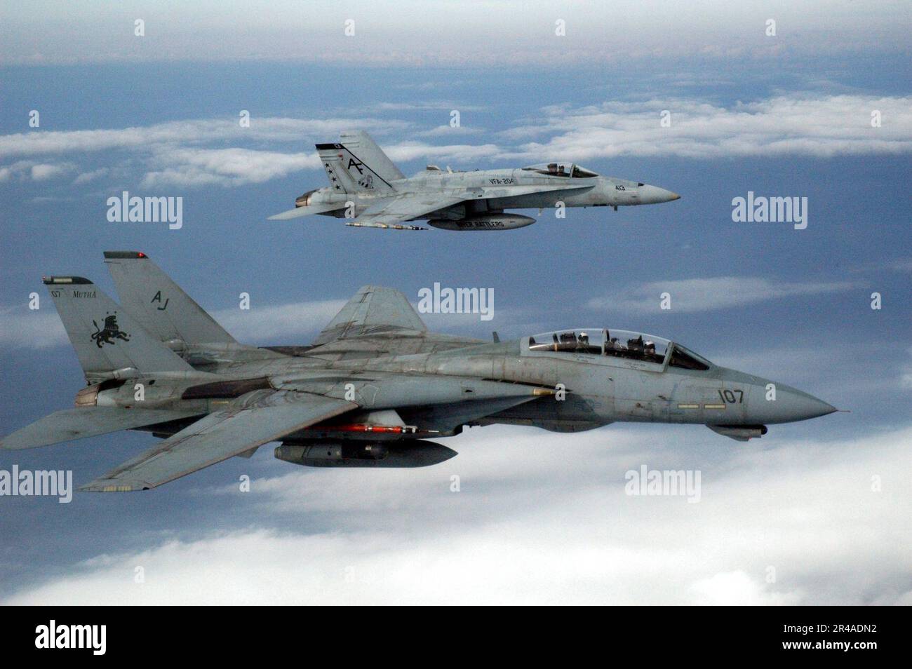 US Navy An F-14D Tomcat flies in a loose formation with an F-A-18A ...