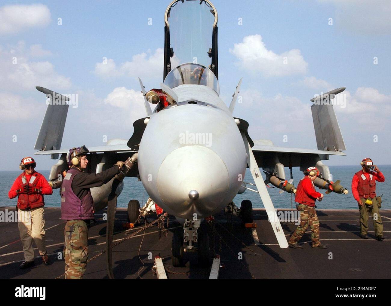 US Navy Sailors assigned to the Gunslingers of Strike Fighter Squadron ...