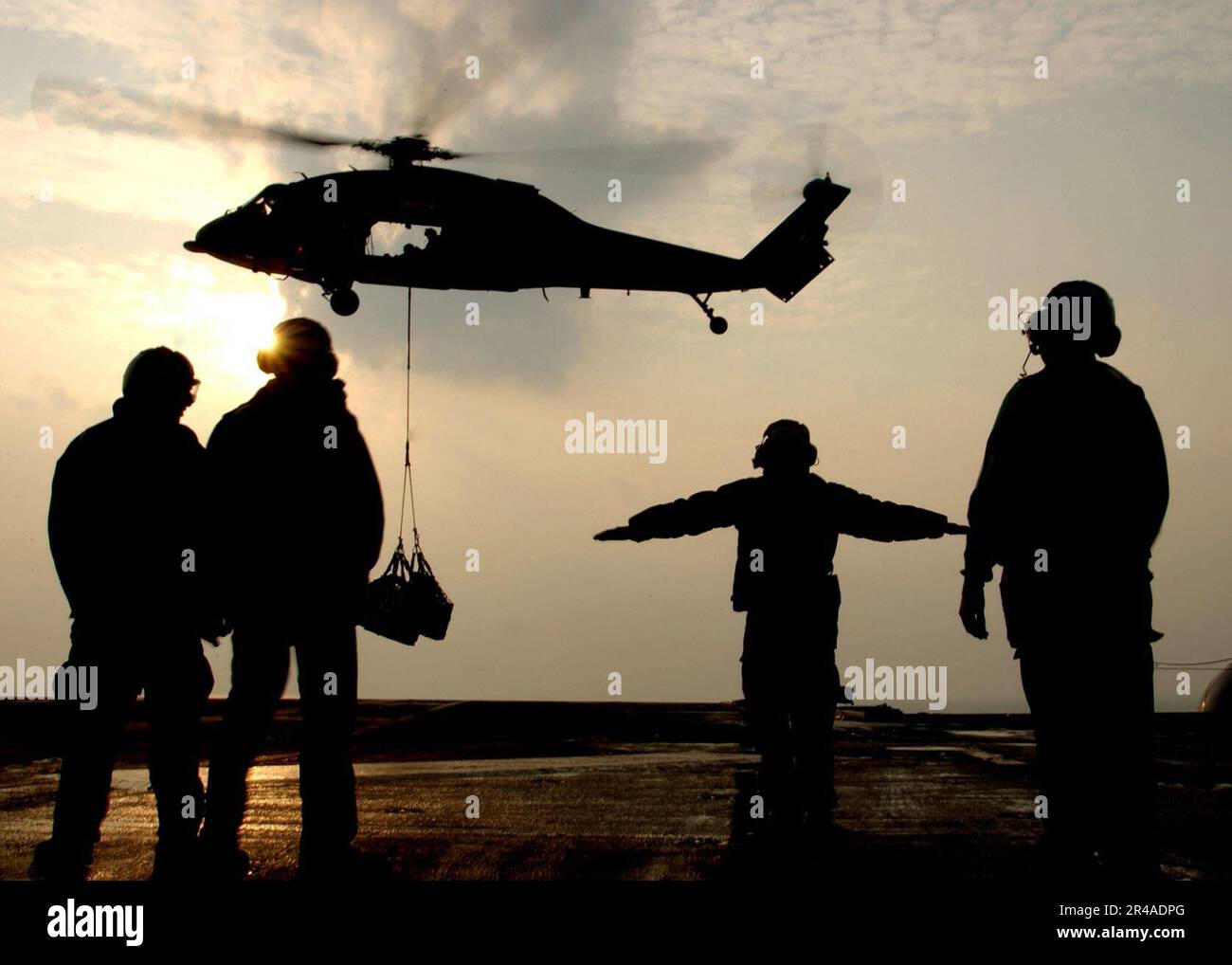 US Navy An Aircraft Director directs an MH-60 Knighthawk Helicopter ...