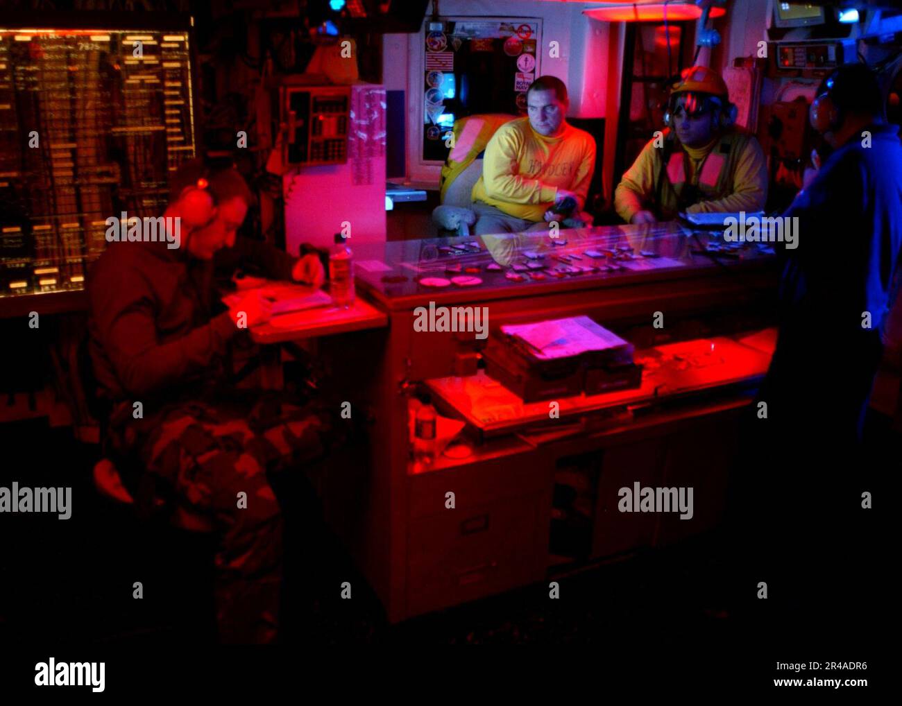 US Navy Flight Deck Control personnel monitor flight operations while ...