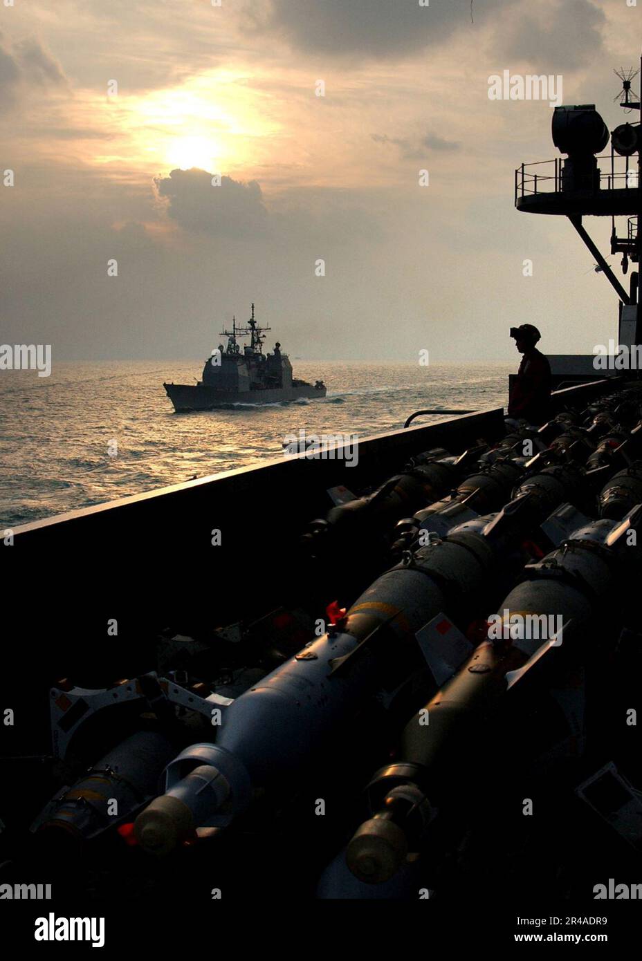 US Navy An Aviation Ordnanceman stands watch over the bomb farm as the ...
