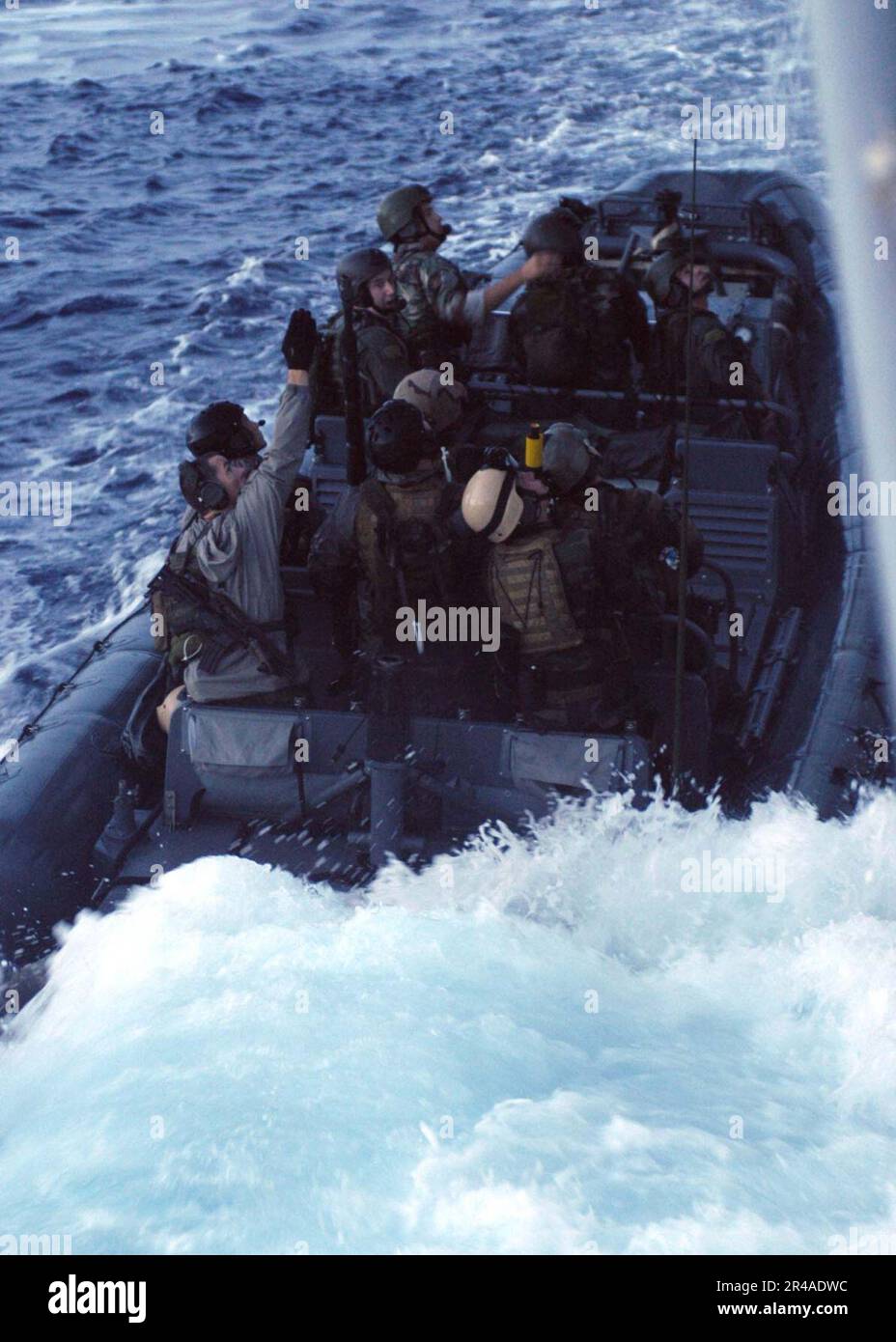 US Navy U.S. Navy Seals speed past the port side of the guided missile ...