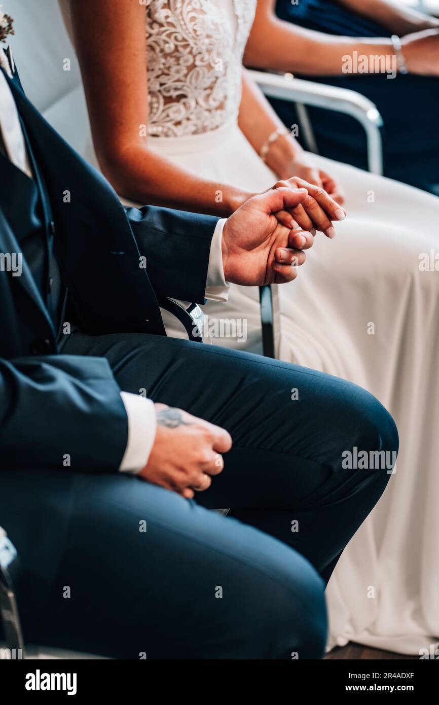 The bride and the groom in a church during their wedding ceremony Stock ...