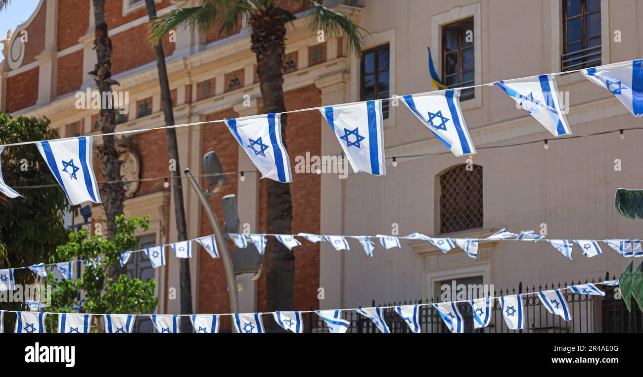 Garlands made of flags of Israel on city street Stock Photo - Alamy