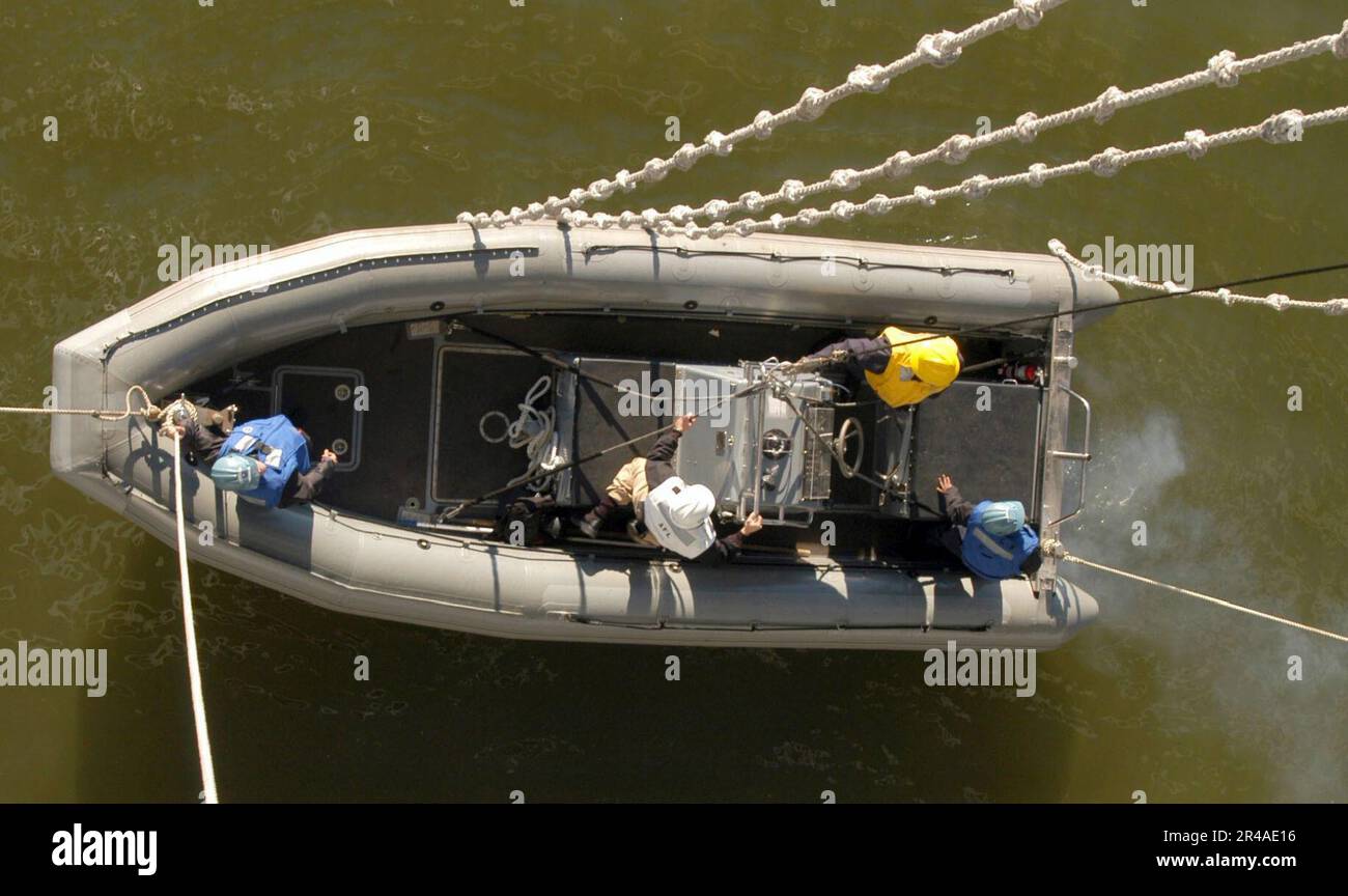 US Navy Deck Department personnel deploys the ship's Rigid Hull ...