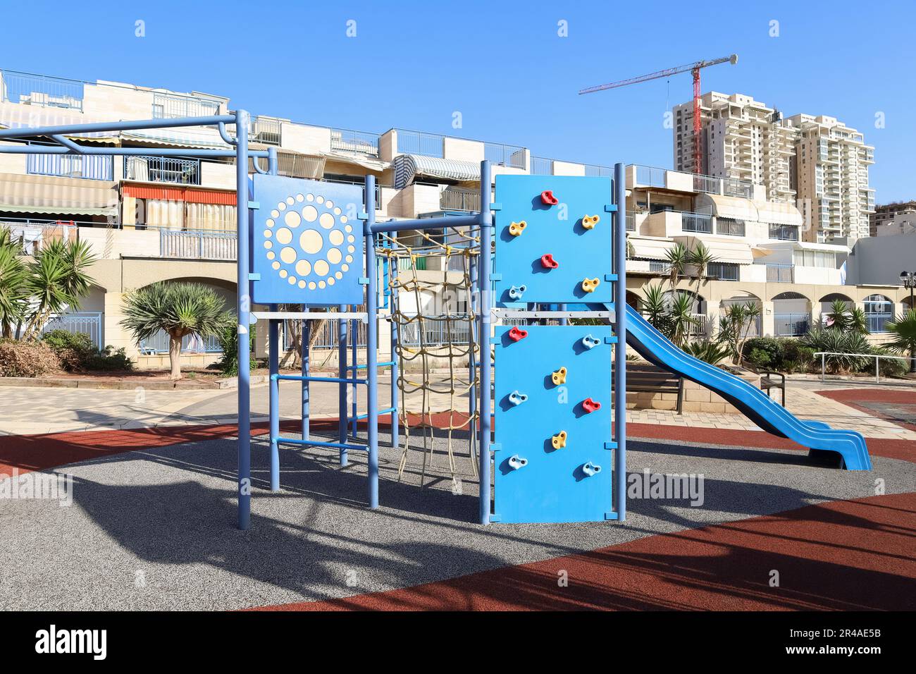 View of children's playground with slide at sea resort Stock Photo - Alamy