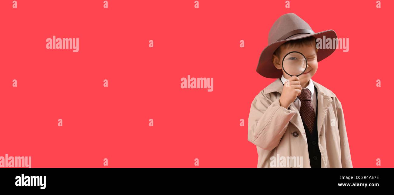 Cute little detective with magnifier on red background with space for ...
