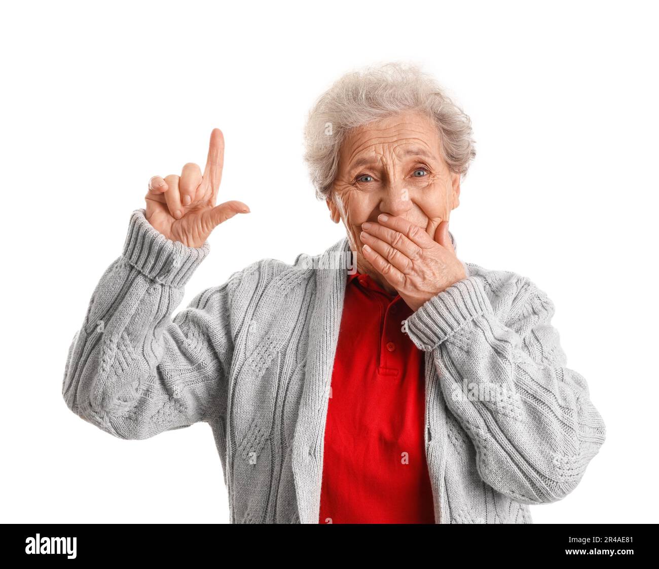 Senior woman showing loser gesture on white background Stock Photo - Alamy