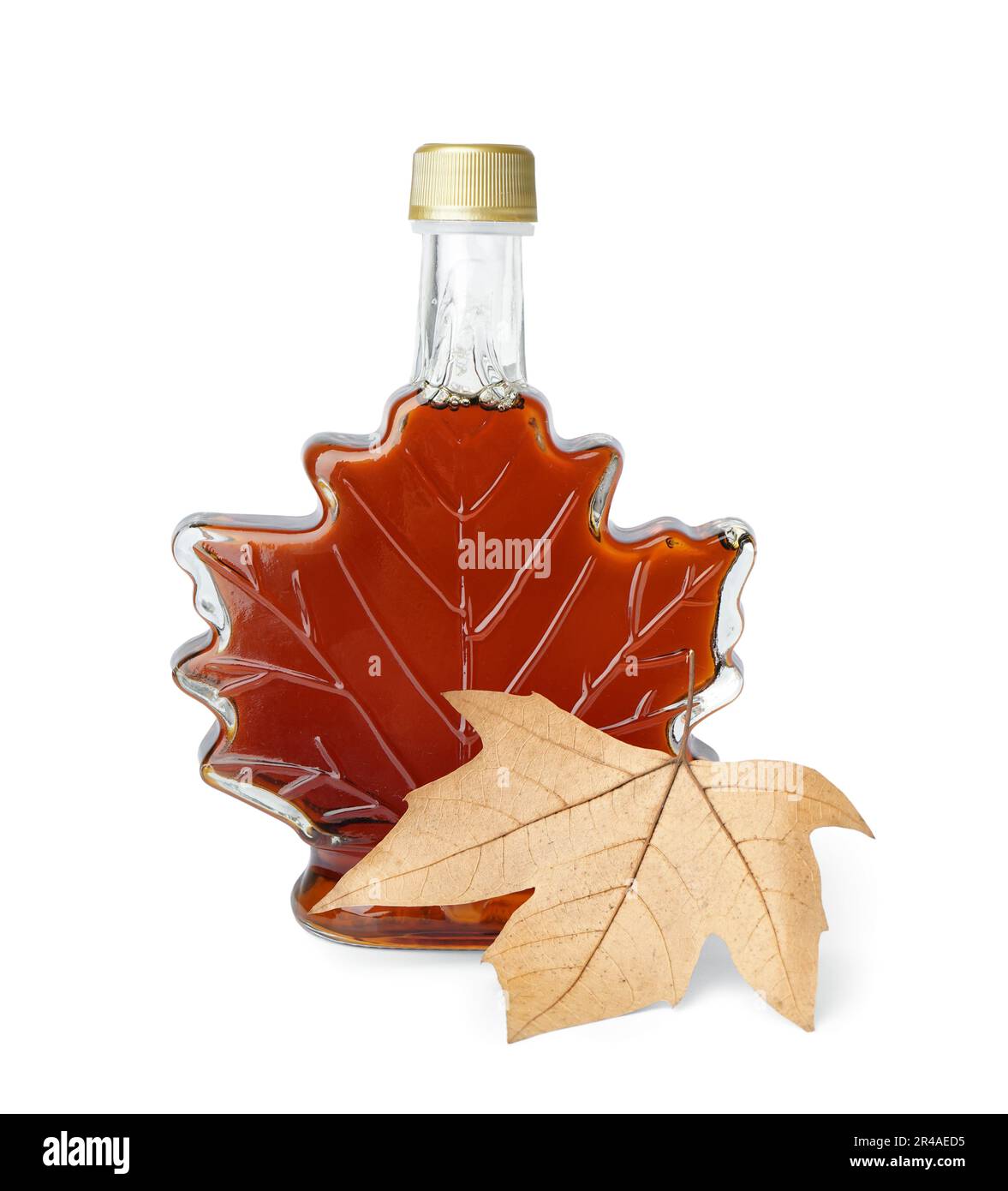 Bottle of sweet maple syrup and leaf isolated on white background Stock ...