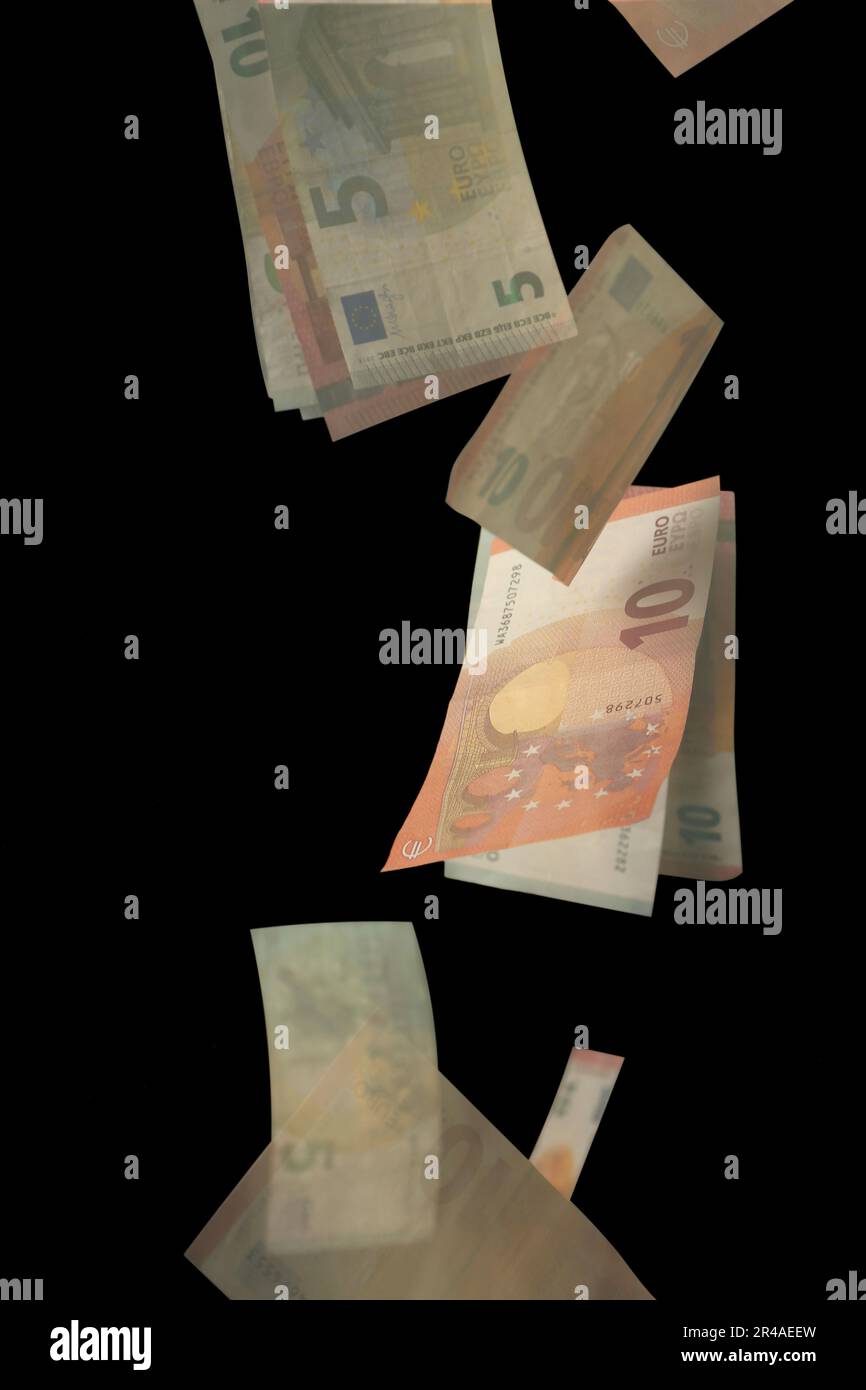 Stroboscopic photo of falling euro banknotes on dark background Stock ...
