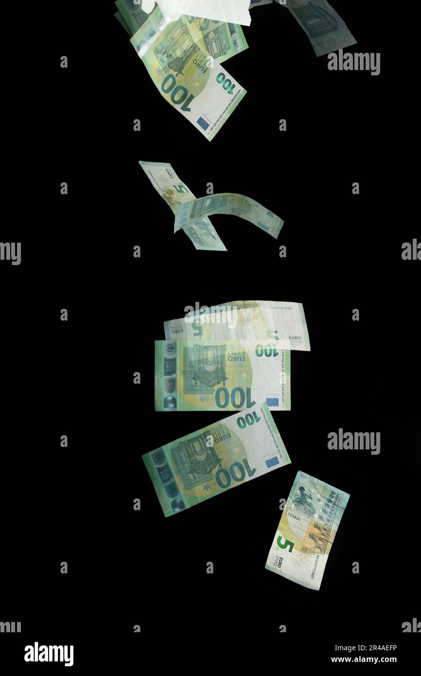 Stroboscopic photo of falling euro banknotes on dark background Stock ...