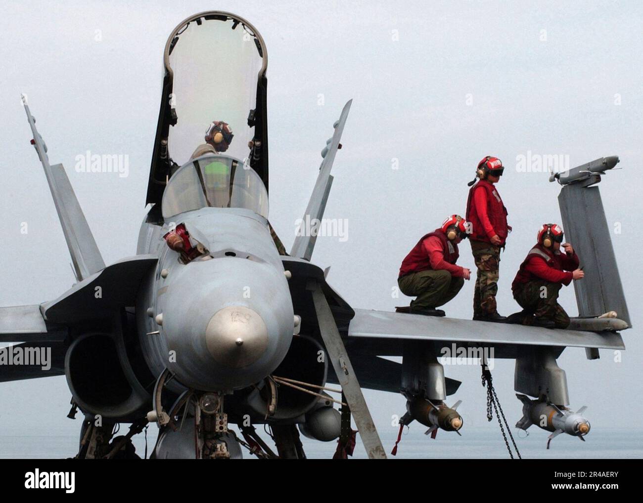 US Navy Sailors, assigned to the Bulls of Strike Fighter Squadron Three ...