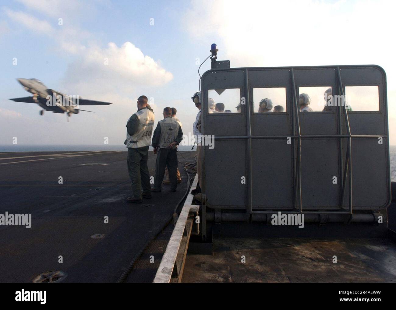 US Navy Landing Signal Officers (LSO) recover an F-14B Tomcat during ...
