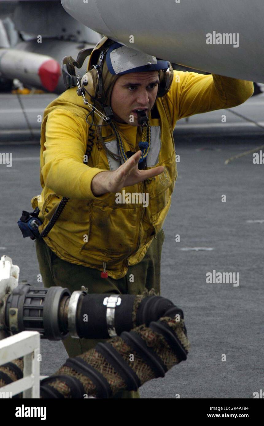 US Navy An aircraft handler from USS Abraham Lincoln's (CVN 72) Air ...