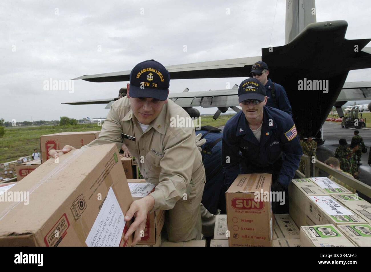US Navy Sailors from USS Abraham Lincoln with the help of military ...