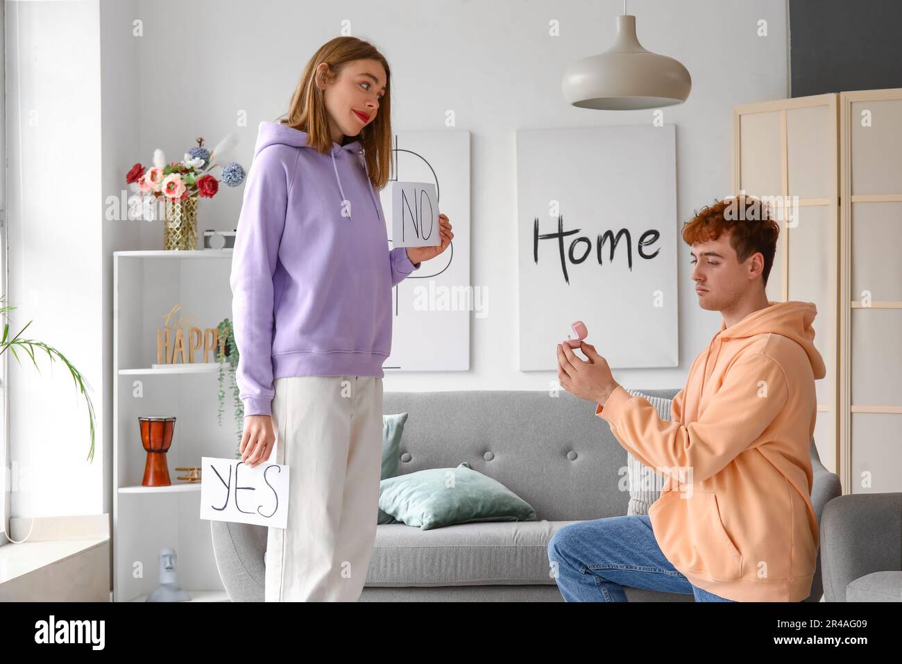 Young woman rejecting marriage proposal from her boyfriend at home ...