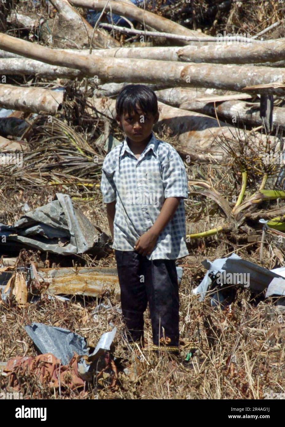 US Navy An Indonesian child stands amid the destruction of the Tsunami ...