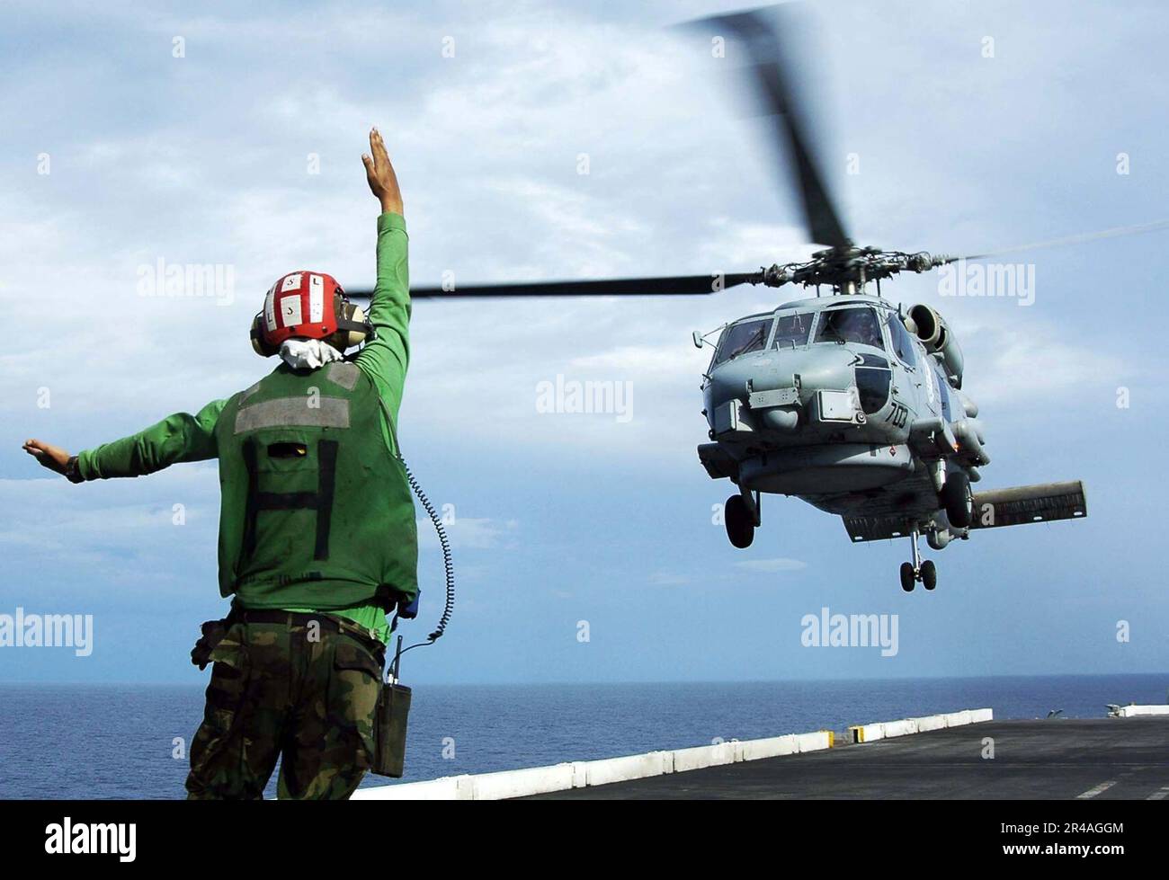US Navy A Landing Signals Enlisted (LSE) direct an SH-60B Seahawk ...