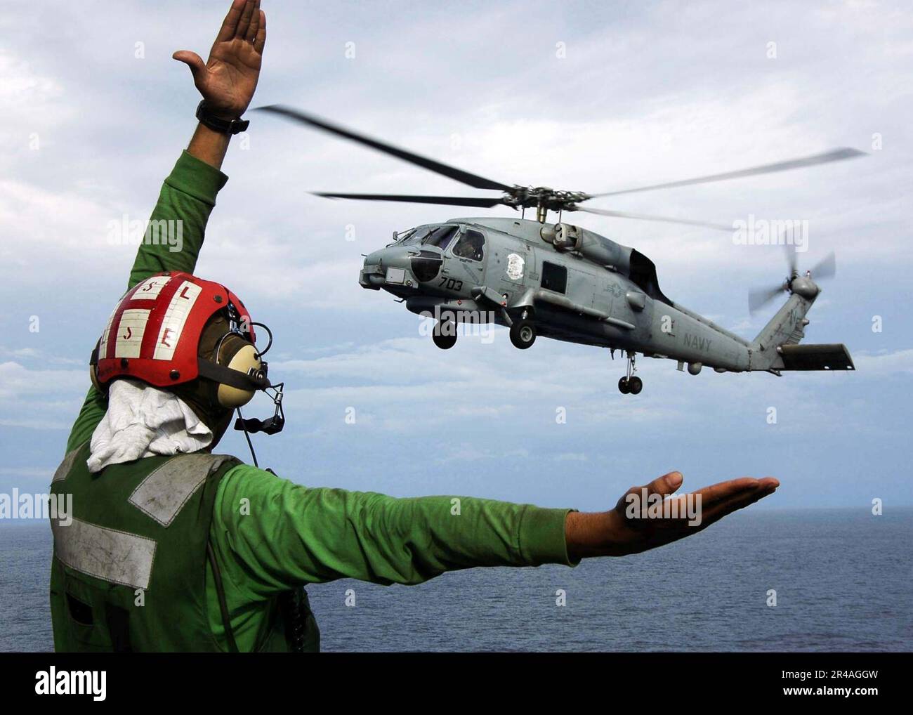 US Navy A Landing Signals Enlisted (LSE) direct an SH-60B Seahawk ...