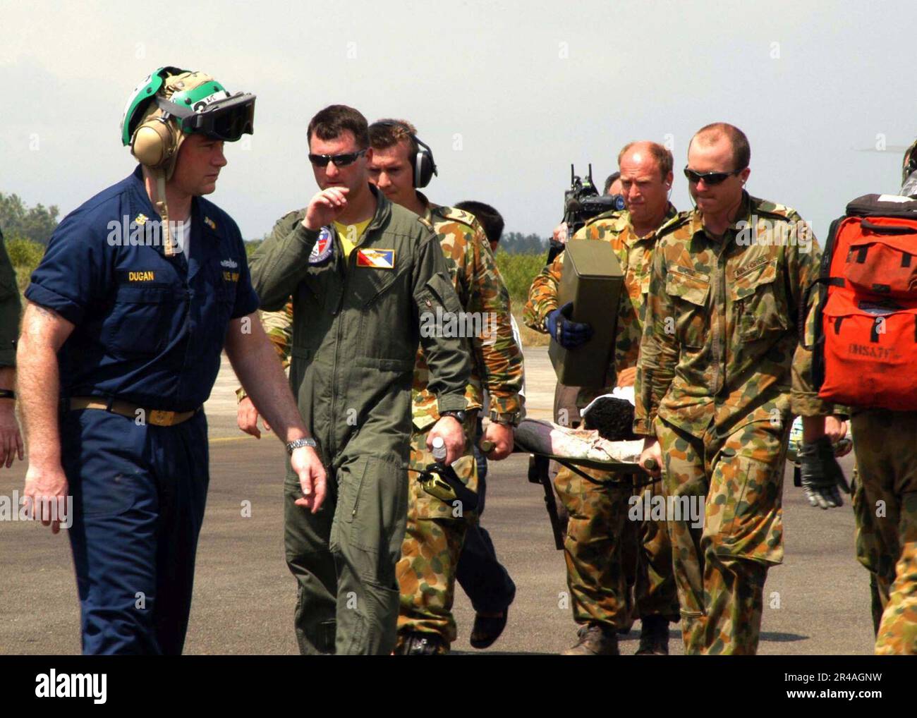 US Navy U.S. Navy and International military members transport an ...