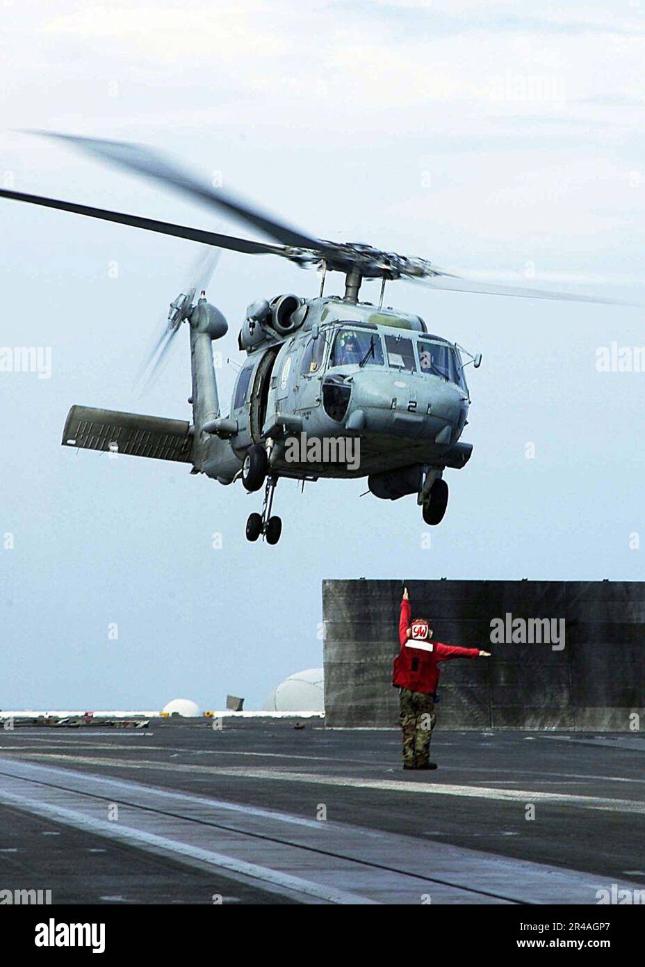 US Navy A Landing Signals Enlisted (LSE) Sailor launches a SH-60F ...