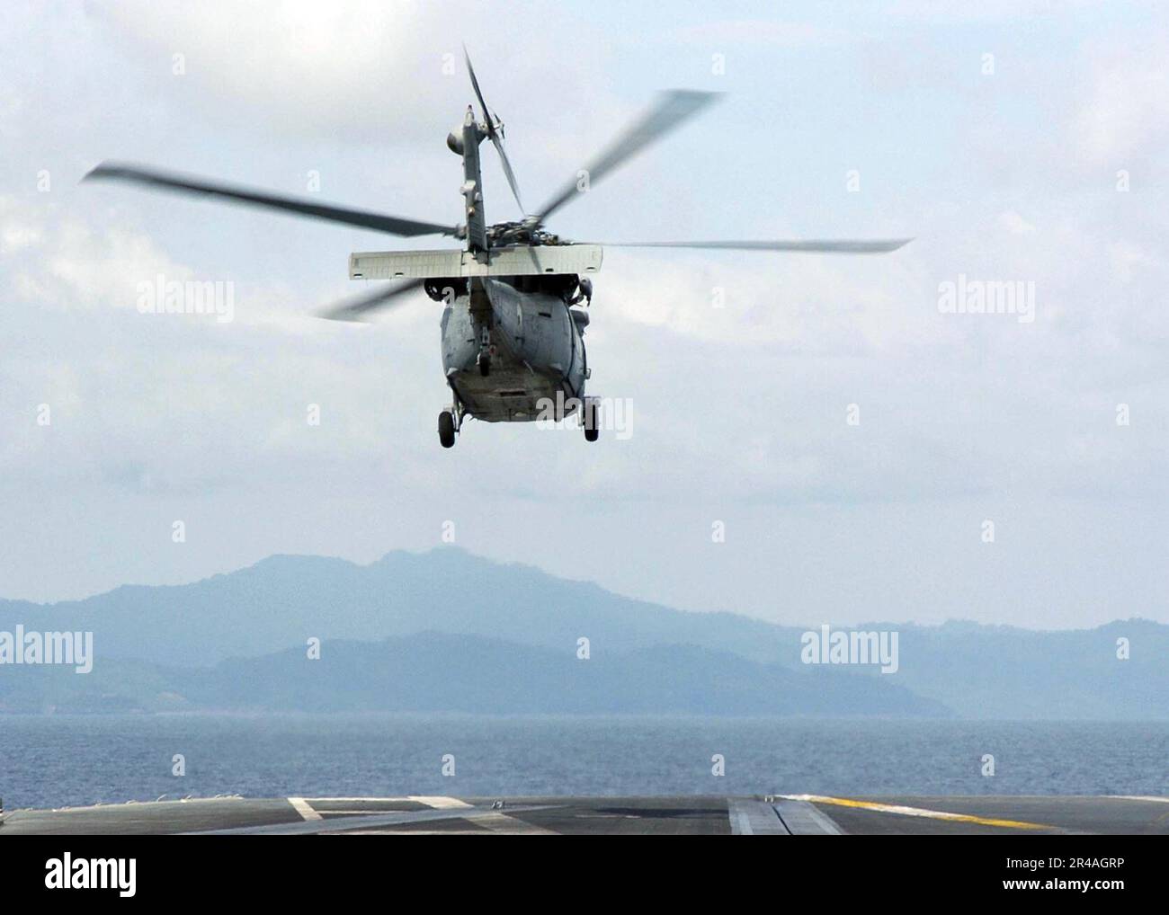 US Navy An MH-60S Knighthawk helicopter, assigned to the Gunbearers of Helicopter Combat Support ...
