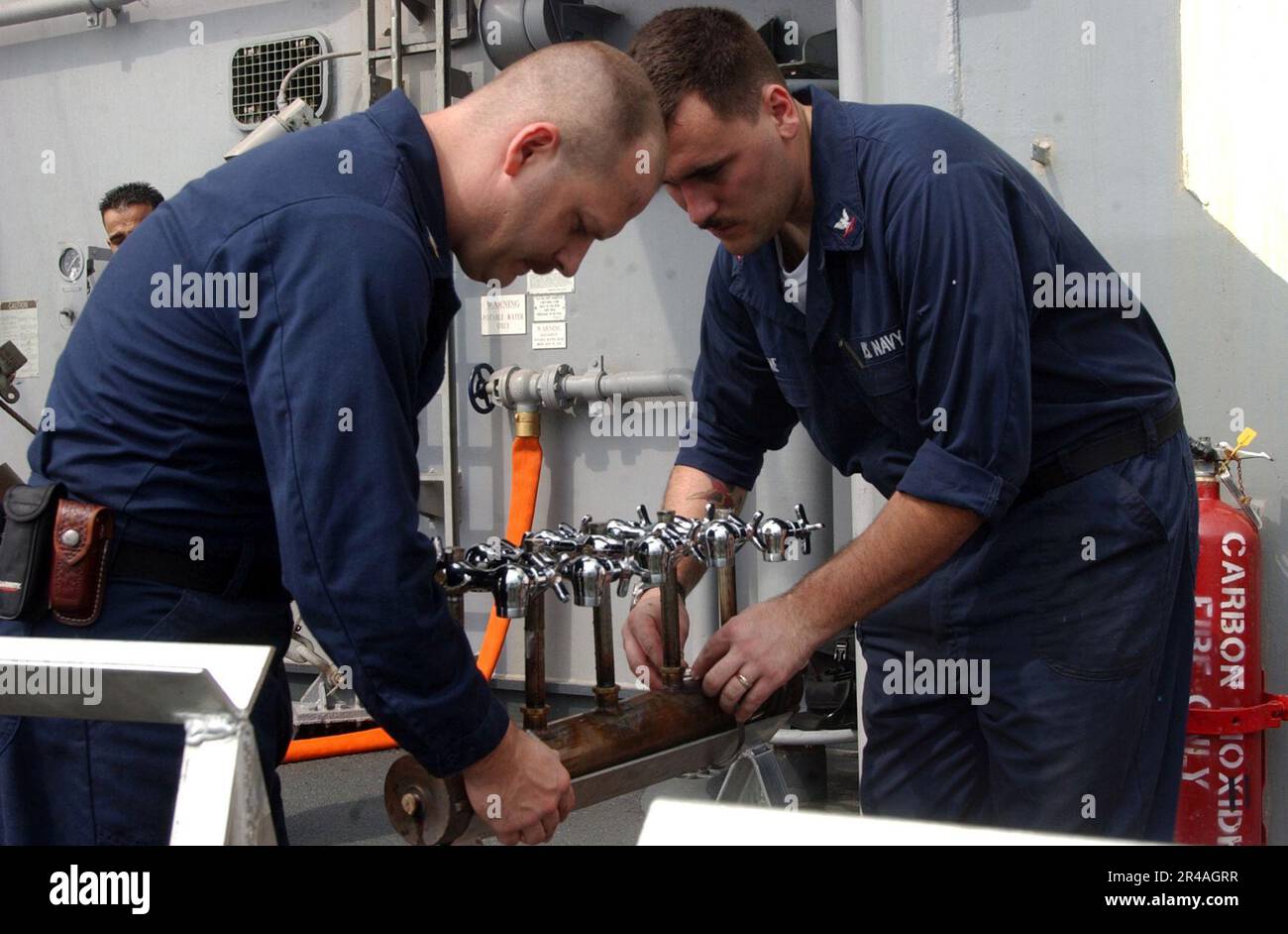 US Navy Hull Maintenance Technician 1st Class left, and Hull ...