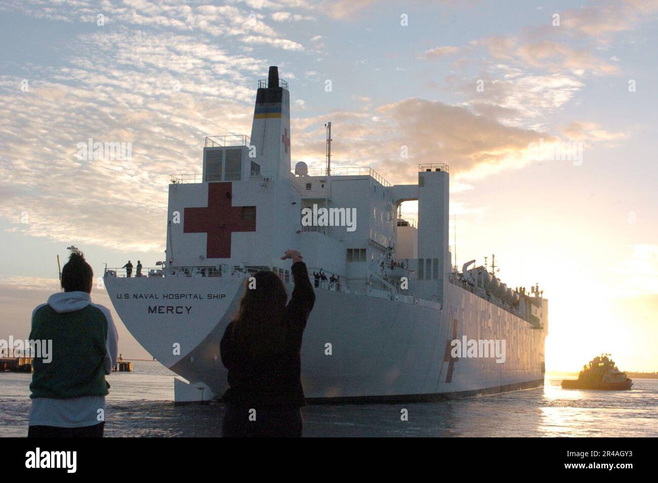 US Navy Family members wave farewell as the Military Sealift Command ...