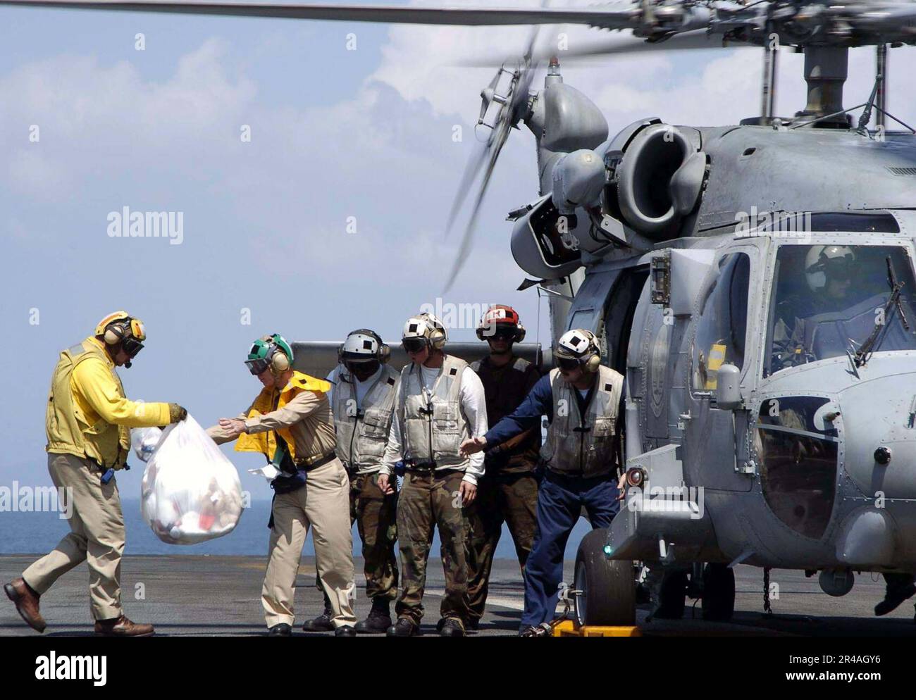 Us Navy Crew Members Aboard Uss Abraham Lincoln Cvn 72 Load Bags Of