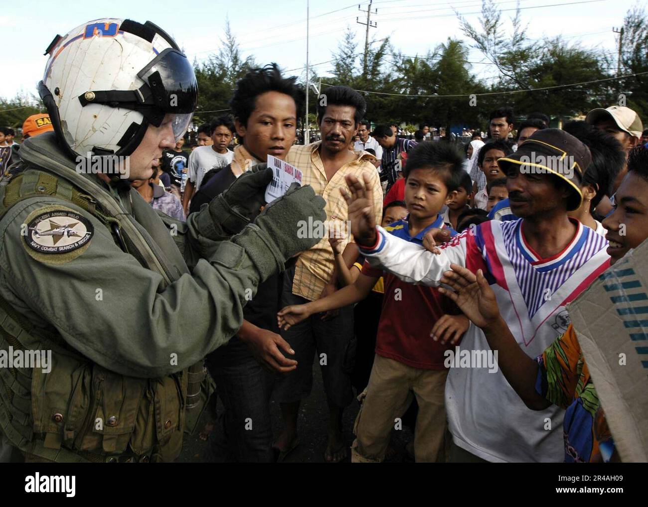 US Navy Residents of Meulaboh, Sumatra, Indonesia gather around ...