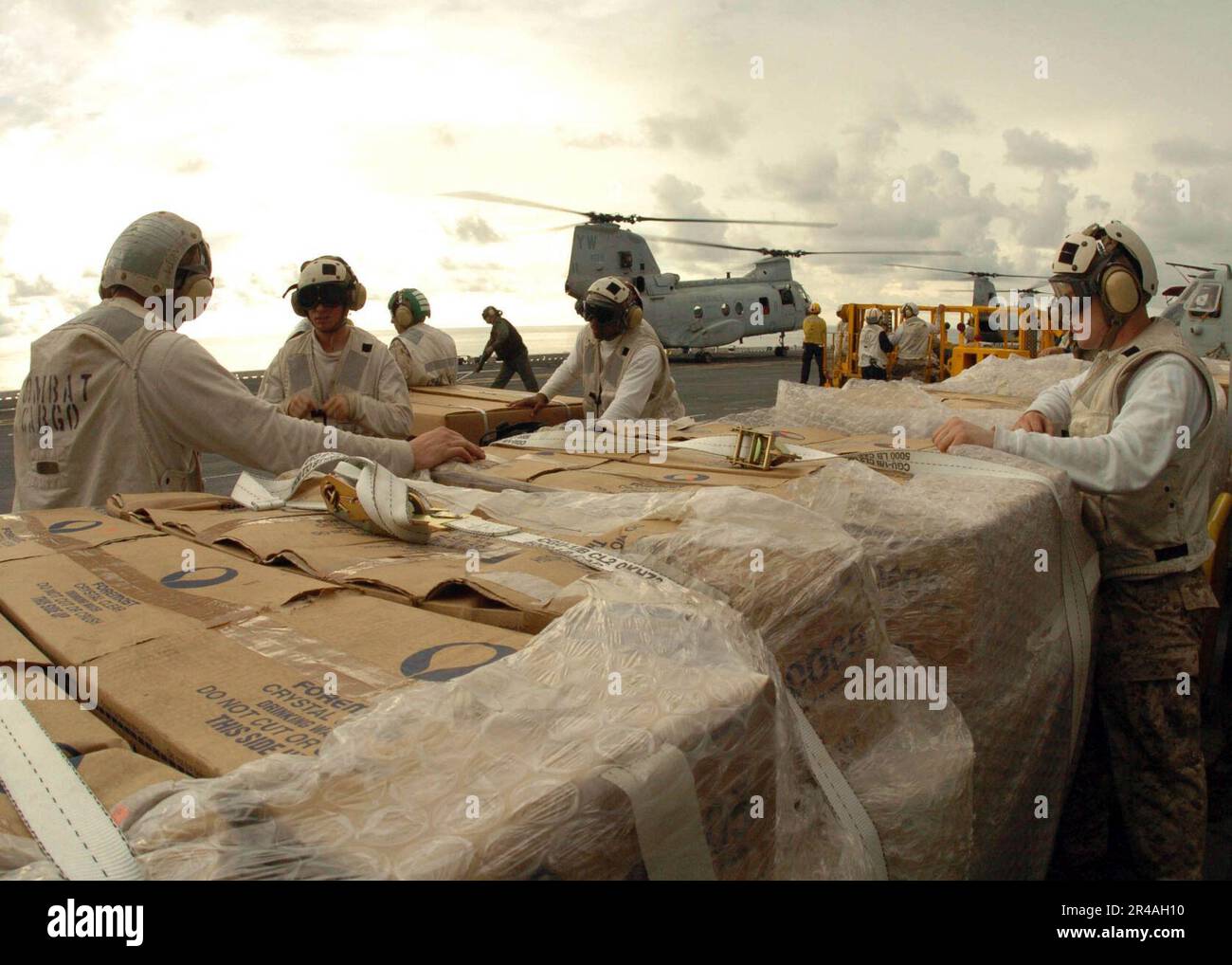 US Navy U.S. Marines assigned to the Combat Cargo division aboard the ...