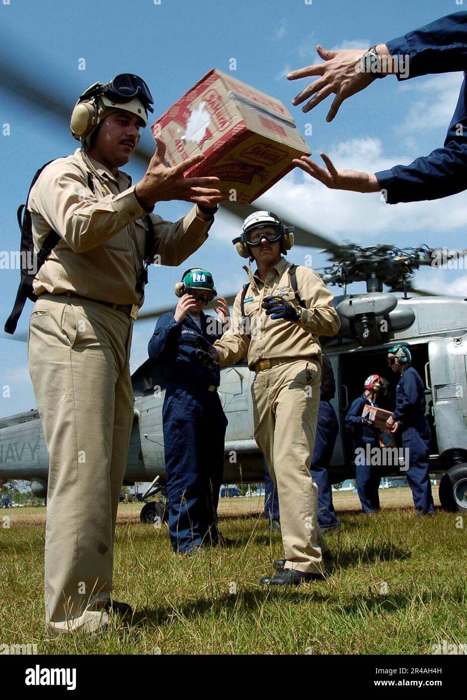 US Navy U.S. Navy personnel load Bags of rice and other humanitarian ...