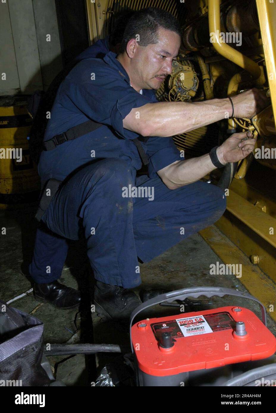 US Navy Aviation Support Equipment Technician 1st Class works on the ...