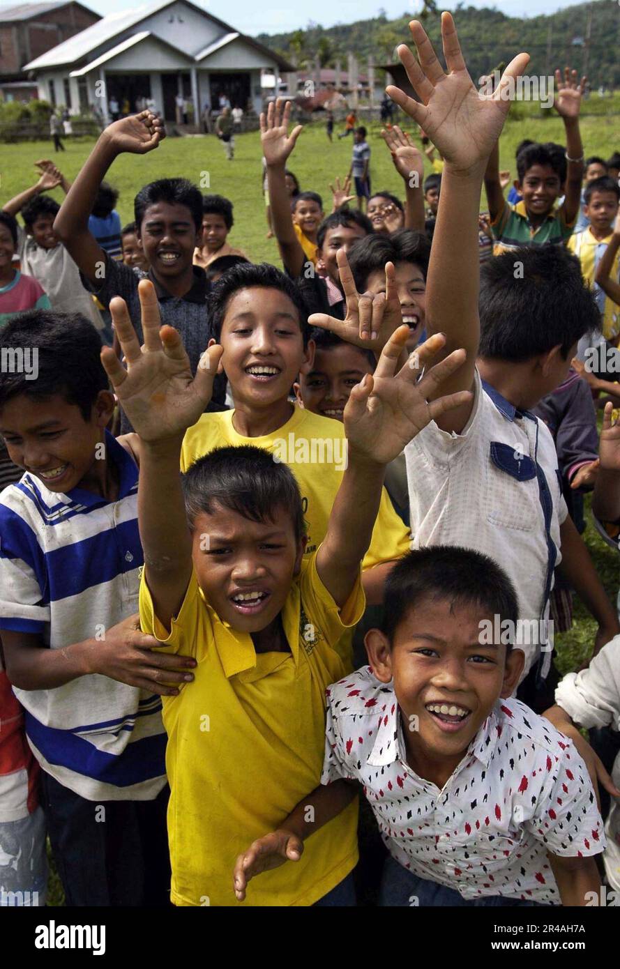 US Navy Indonesian children of a village just inland from the coast of ...