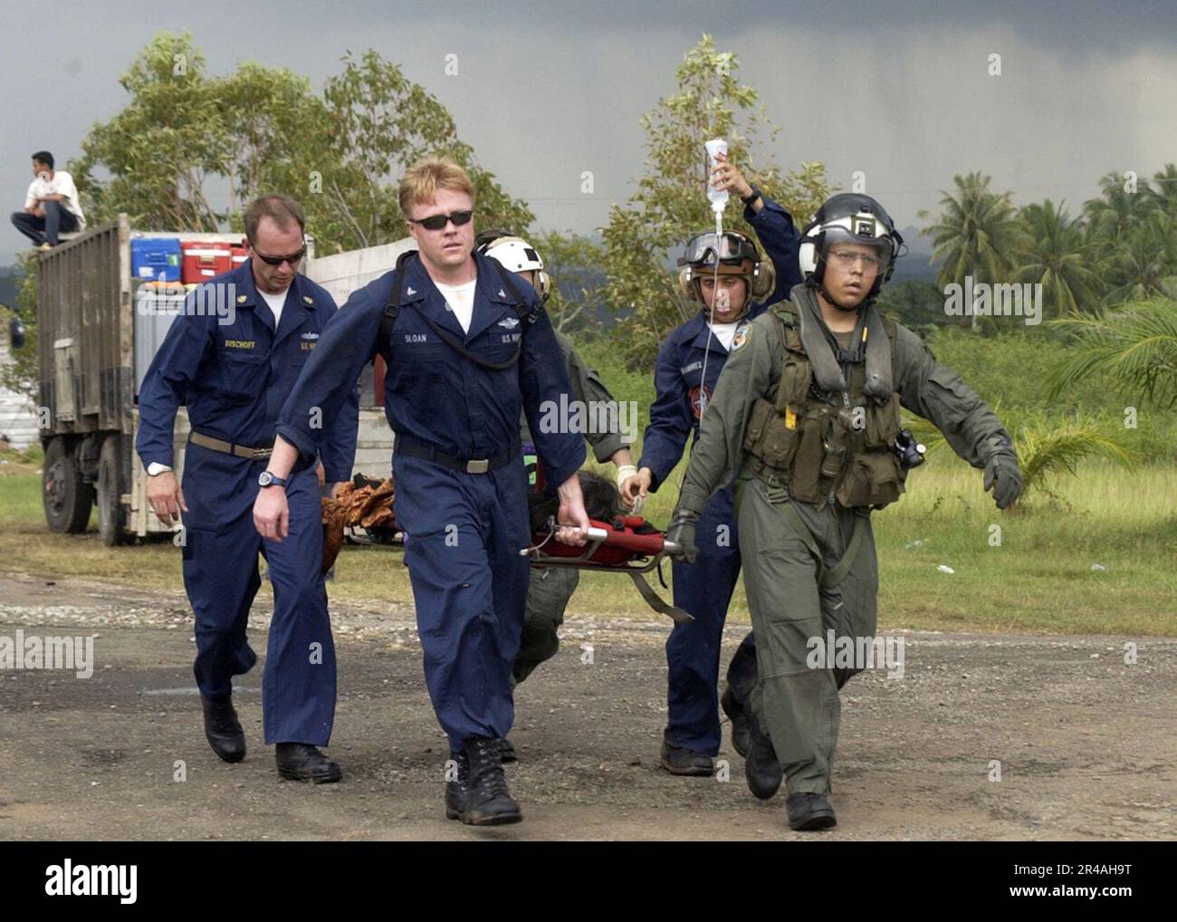 US Navy Sailors assigned to Carrier Air Wing Two (CVW-2) and USS Abraham Lincoln (CVN 72), carry ...