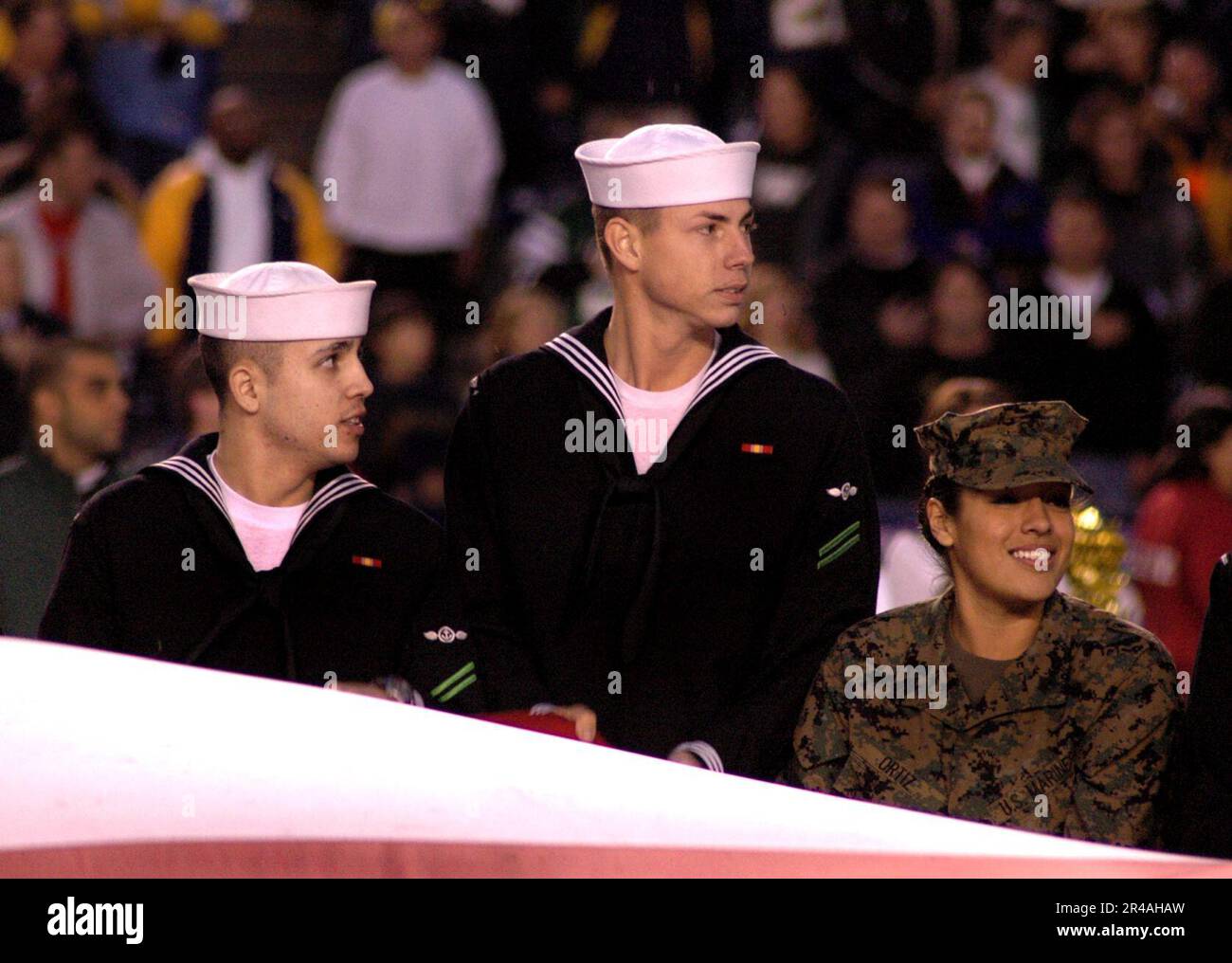 US Navy Sailors and Marines hold on to a reproduction Continental U.S ...