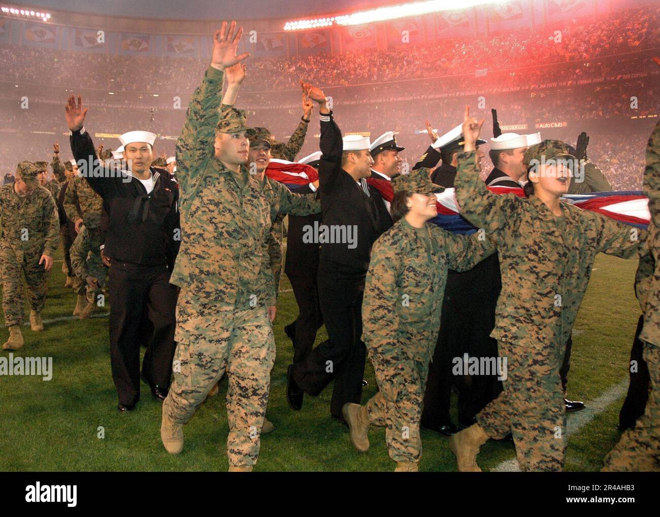 US Navy Sailors and Marines wave to the sold-out Qualcomm Stadium as ...