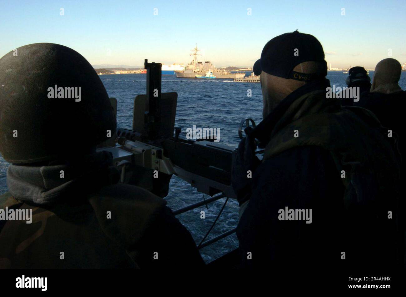 US Navy Sailors stand watch aboard the conventionally-powered aircraft ...
