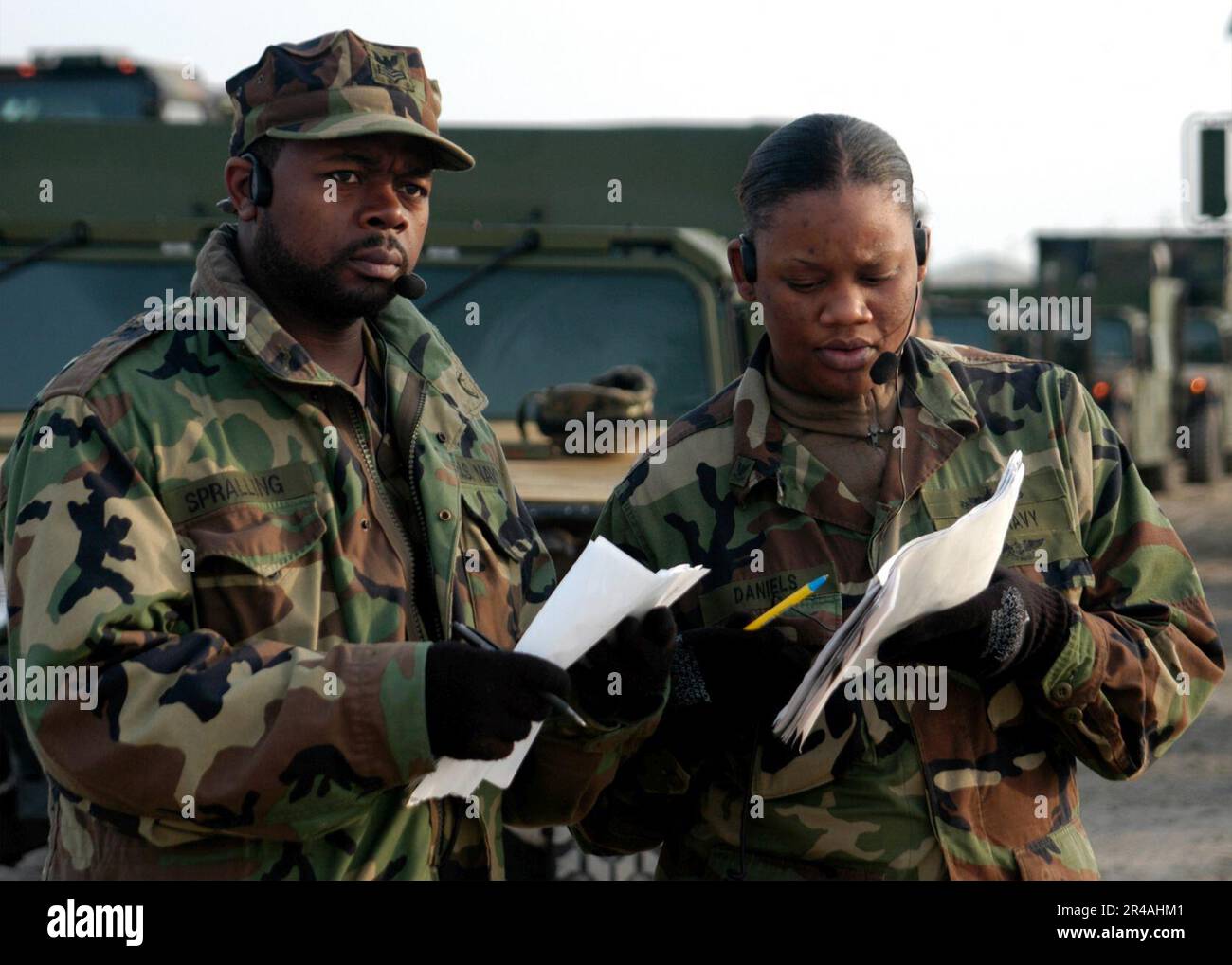 US Navy Operations Specialist 1st Class left, and Boatswain's Mate 3rd ...