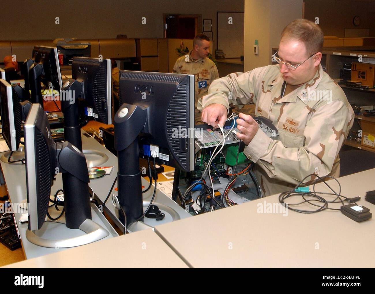 US Navy Electronics Technician 1st Class work to complete a replacement ...
