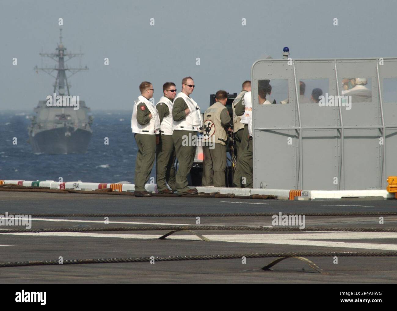 US Navy Landing Signal Officers (LSO) observe USS Oscar Austin (DDG 79 ...