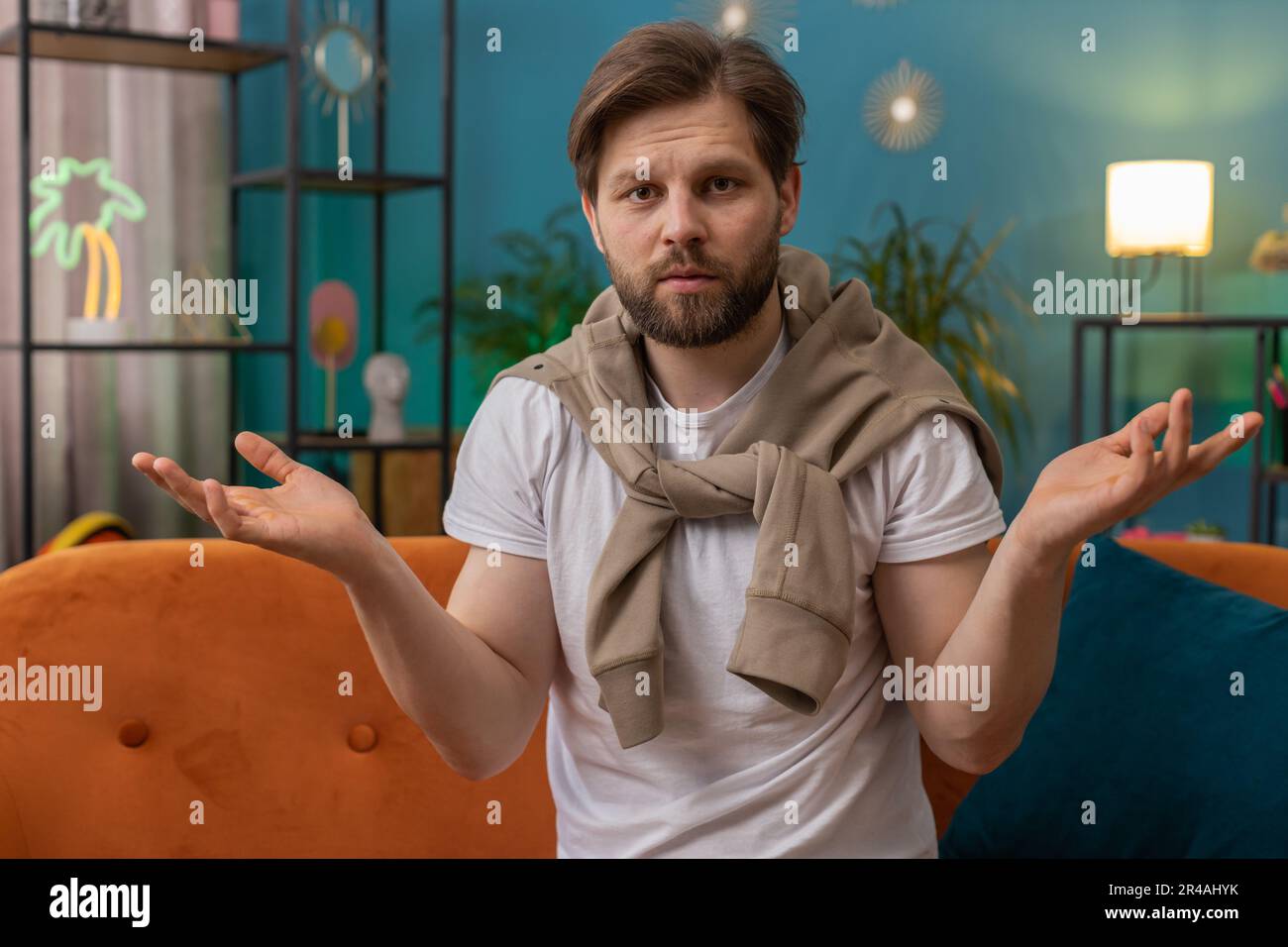 What. Why. Caucasian man raising hands in indignant expression asking ...