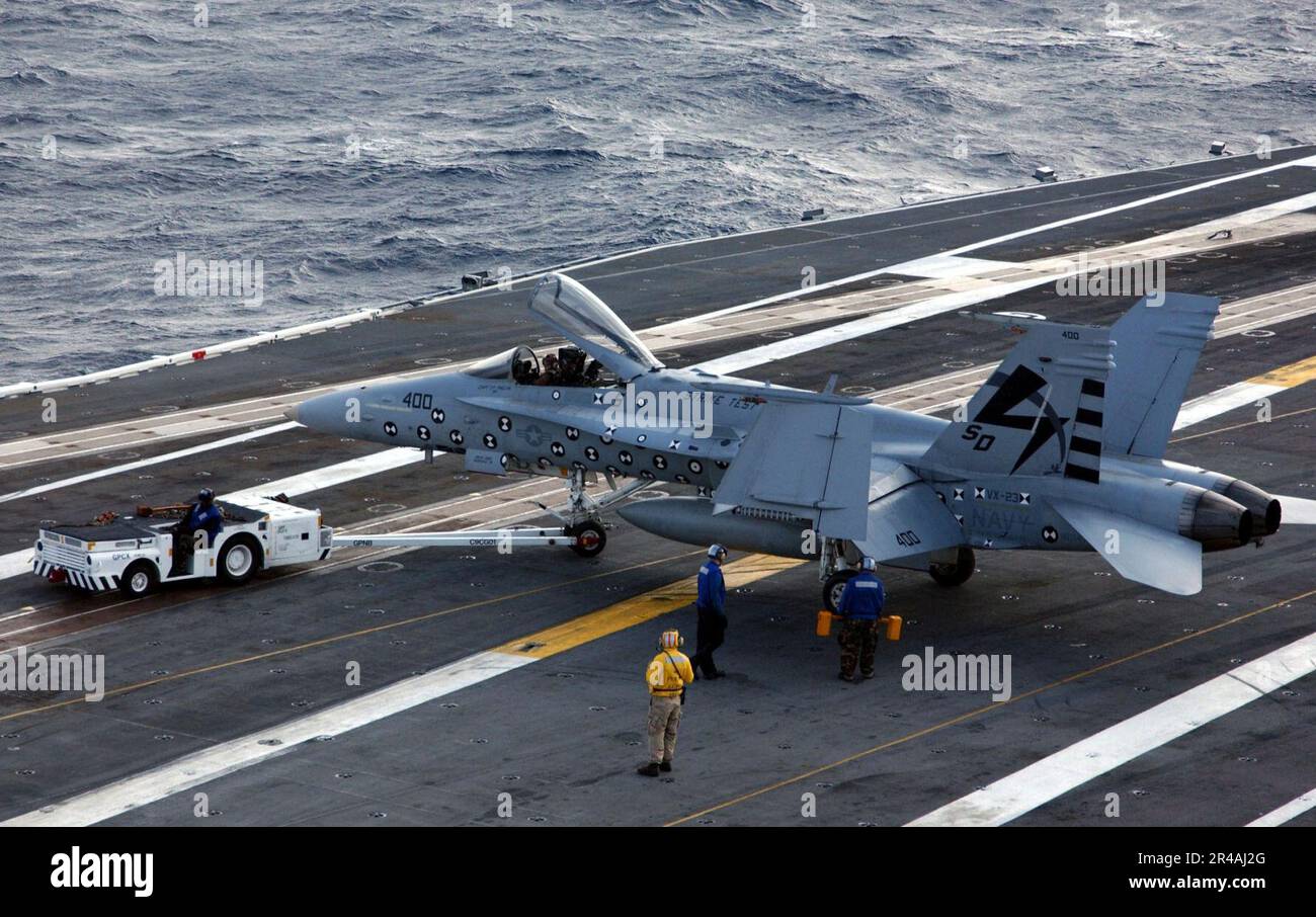 US Navy An F-A-18C Hornet maneuvers on the flight deck aboard USS ...