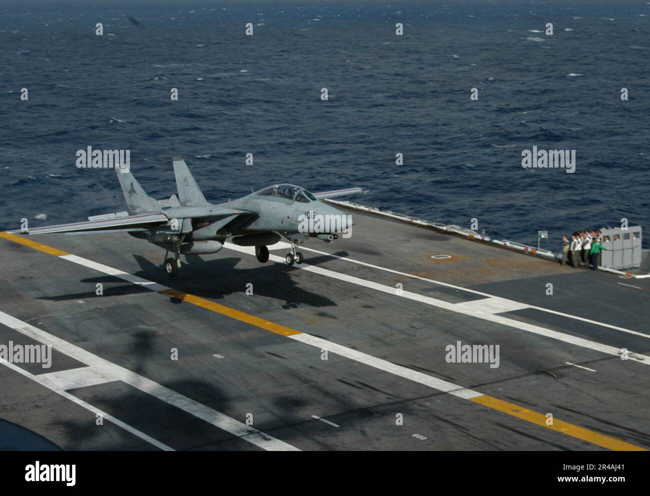 US Navy An F-14D Tomcat is recovered during flight deck operations ...