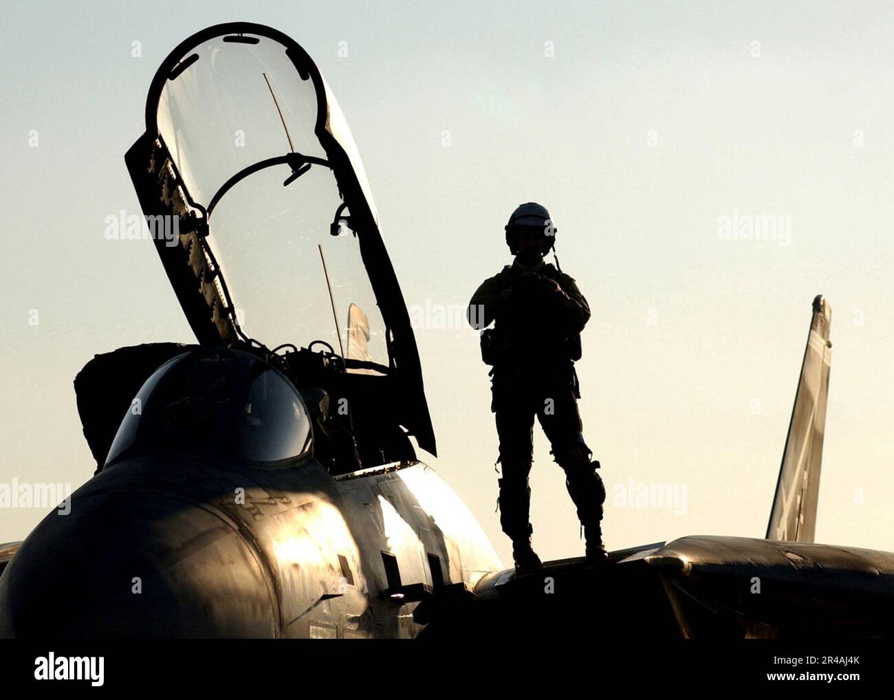 US Navy A pilot prepares to enter his F-14B Tomcat on the flight deck ...