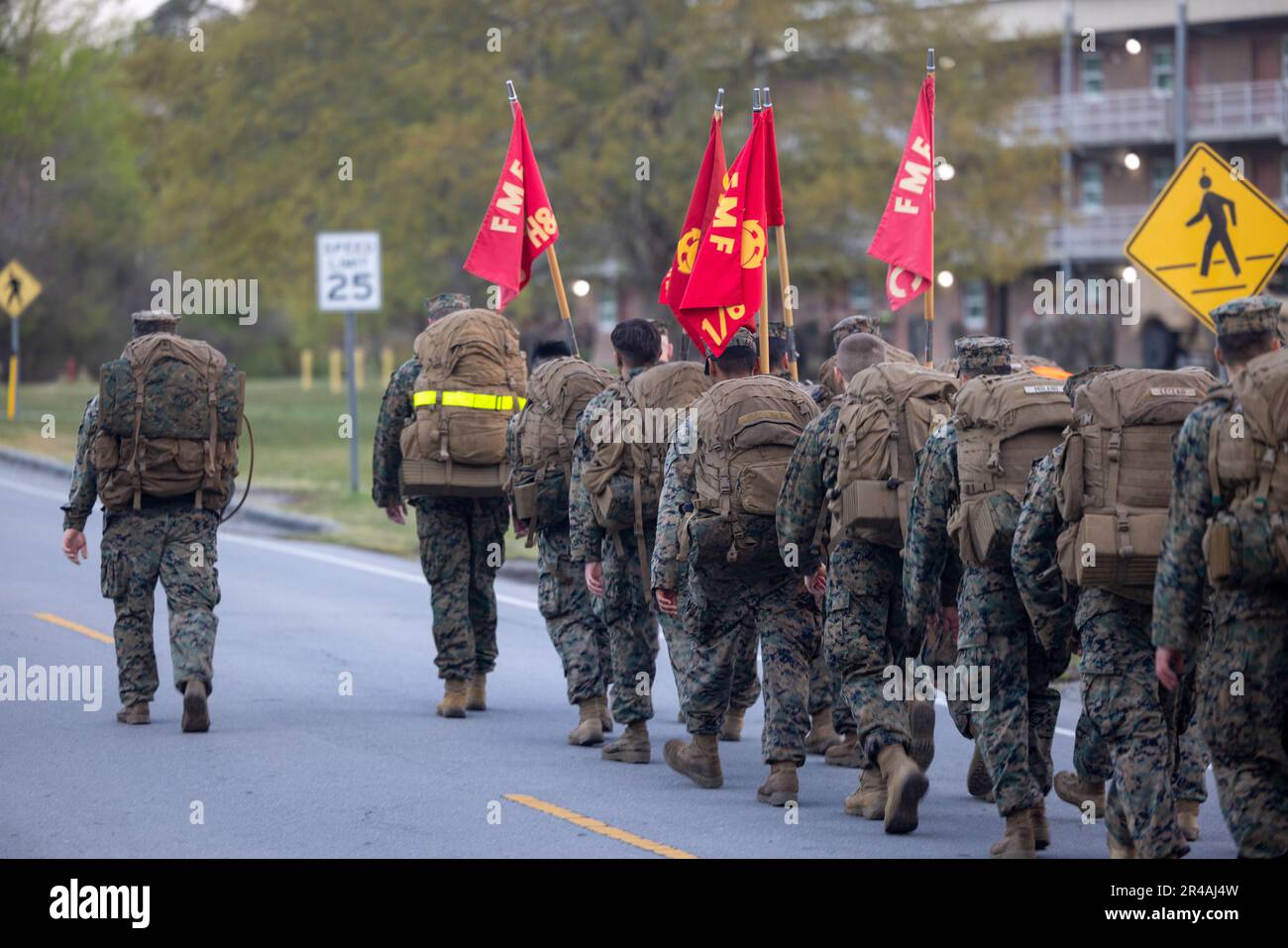 U.S. Marines and Sailors with 2d Marine Division conduct a hike during ...