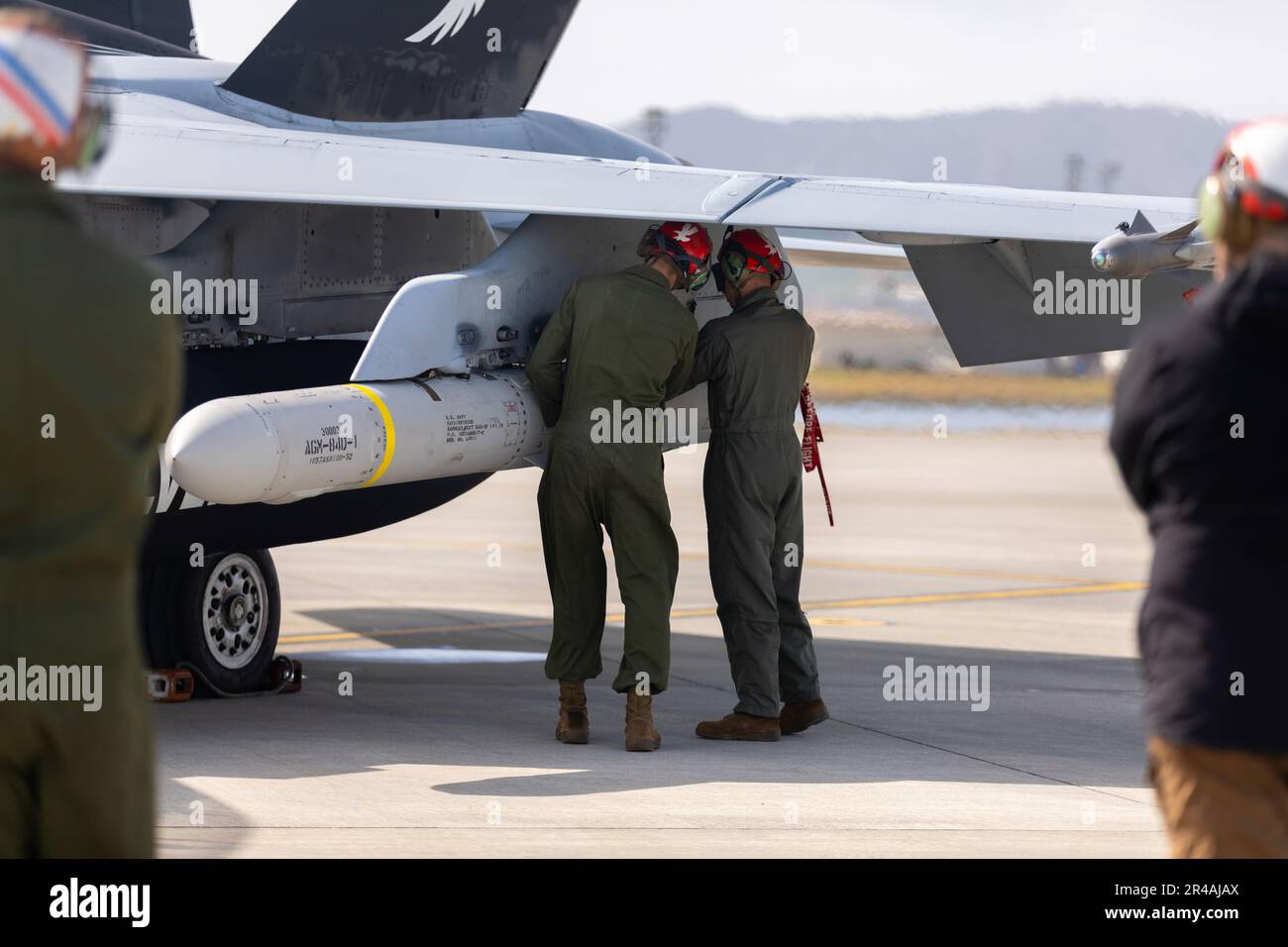 U.S. Marines with Marine Fighter Attack Squadron (VMFA) 115 check an ...