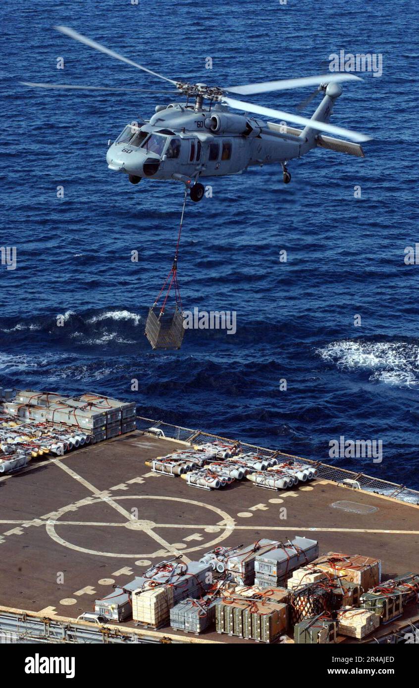 US Navy An MH-60S Knighthawk helicopter prepares to receive and ...