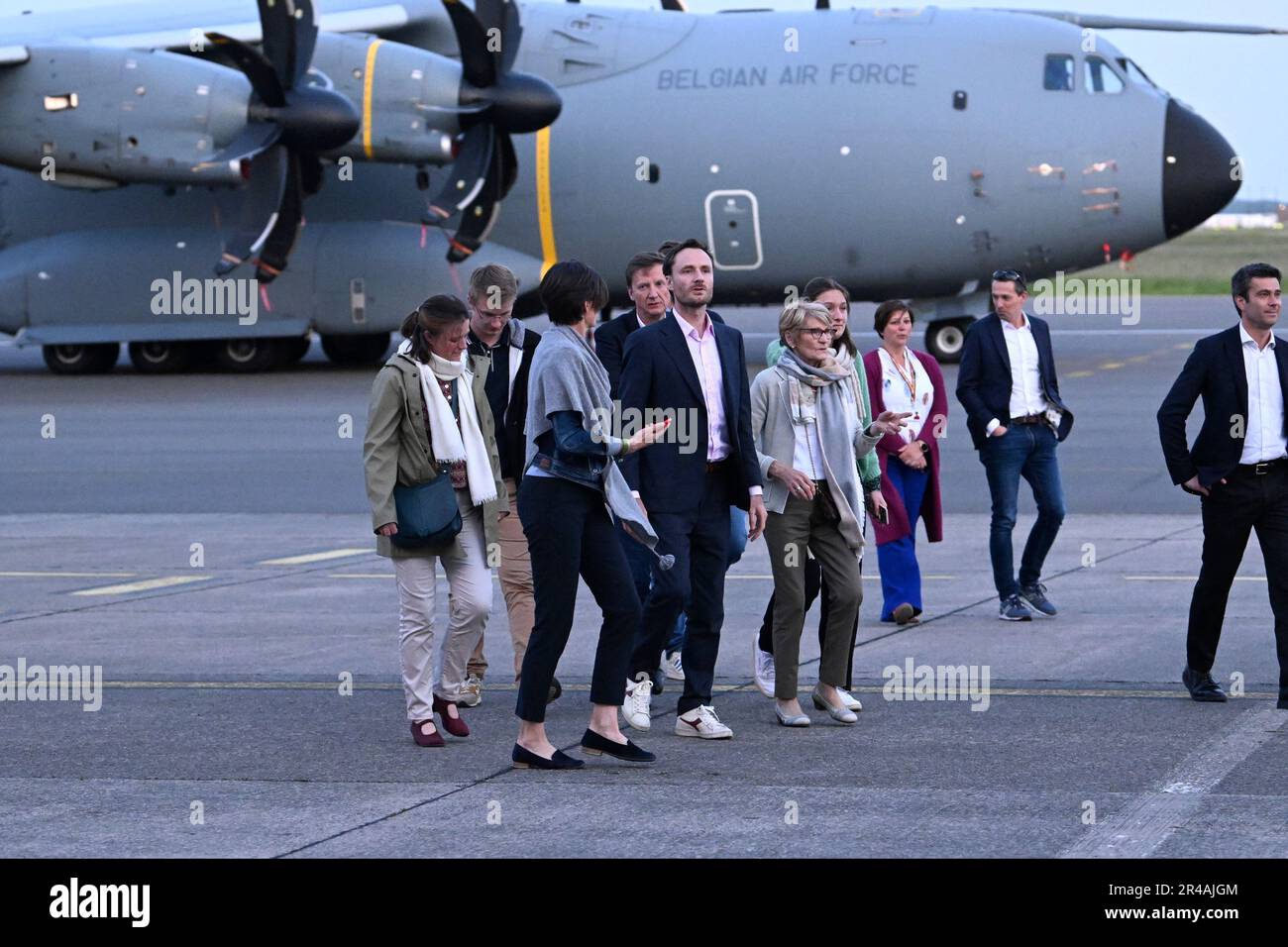 Belgian aid worker Olivier Vandecasteele, center, walks with his family ...