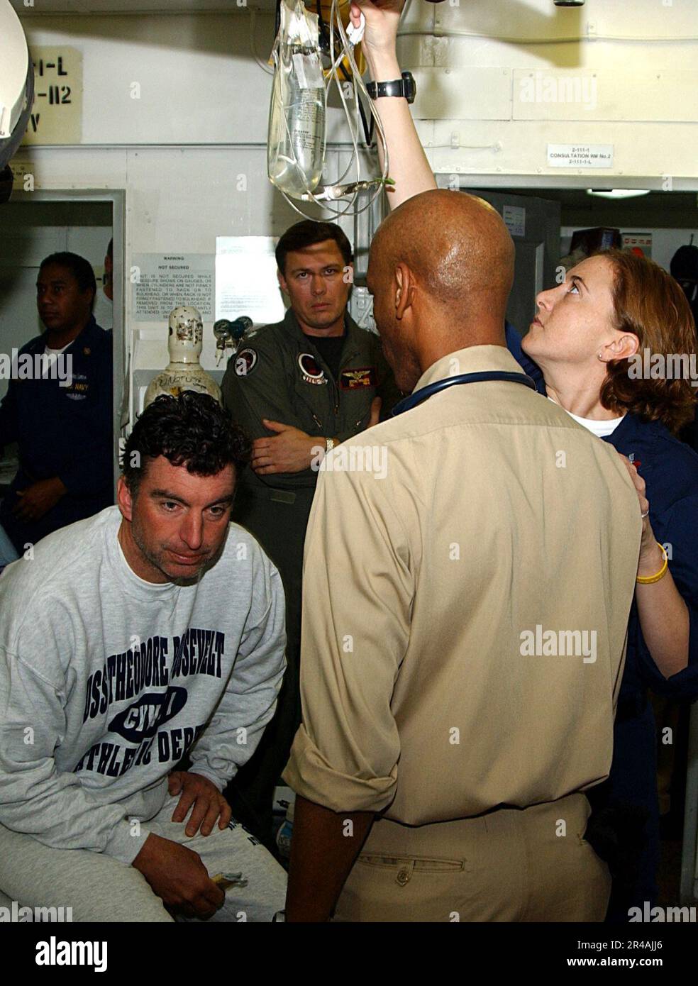 US Navy John Raye from Ottawa, Canada receives medical attention aboard ...